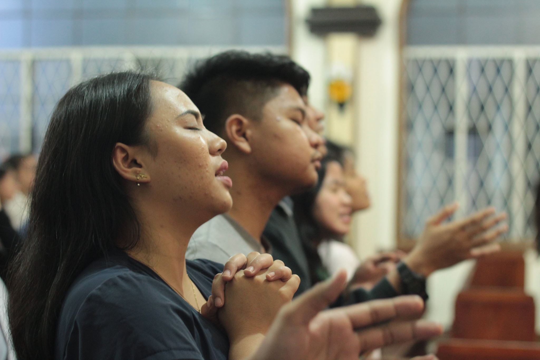 Filipino Praying In Church